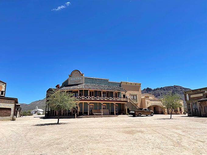 The Grand Palace Hotel and Saloon dominates the skyline, its balcony practically begging for a dramatic showdown scene. John Wayne would approve.