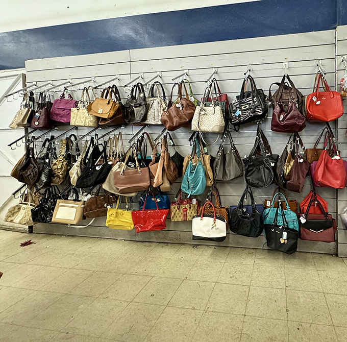 Handbag heaven! Designer purses hang like colorful fruit ripe for picking, each one waiting to start its second chapter with a new owner.