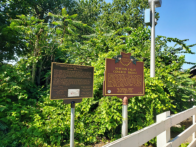 History doesn't just happen; it gets commemorated with bronze plaques that somehow make standing in summer humidity feel educational and worthwhile.