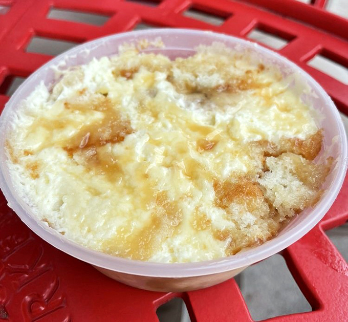 Banana pudding perfection: creamy custard cradling vanilla wafers that have achieved that magical state between crisp and cake-like.