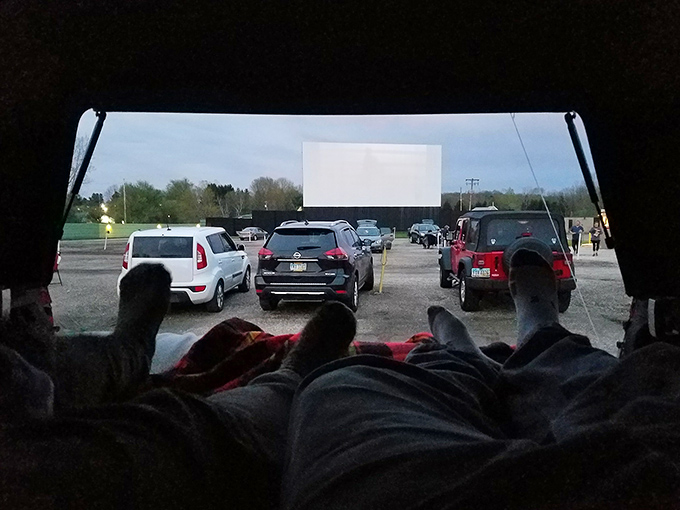 The ultimate movie viewing setup: comfy blankets, stretched-out legs, and a panoramic view of both screen and stars through your windshield.