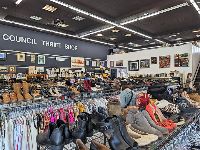 Racks upon racks of carefully organized clothing stretch across the spacious interior, where art adorns walls and shoppers hunt for hidden gems.