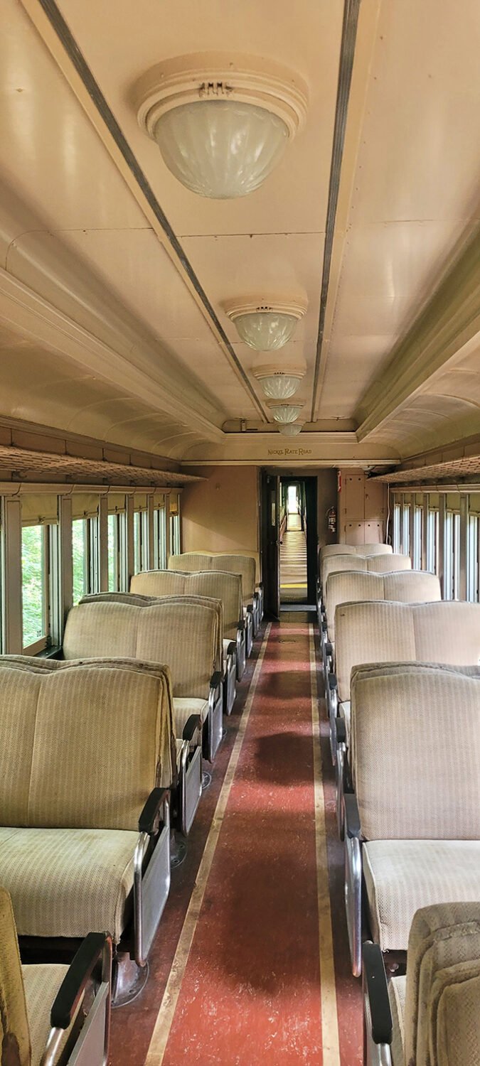Step inside history with these meticulously preserved vintage train car interiors &ndash; where the elegant ceiling fixtures and plush seating whisper stories of rail travel's golden age.