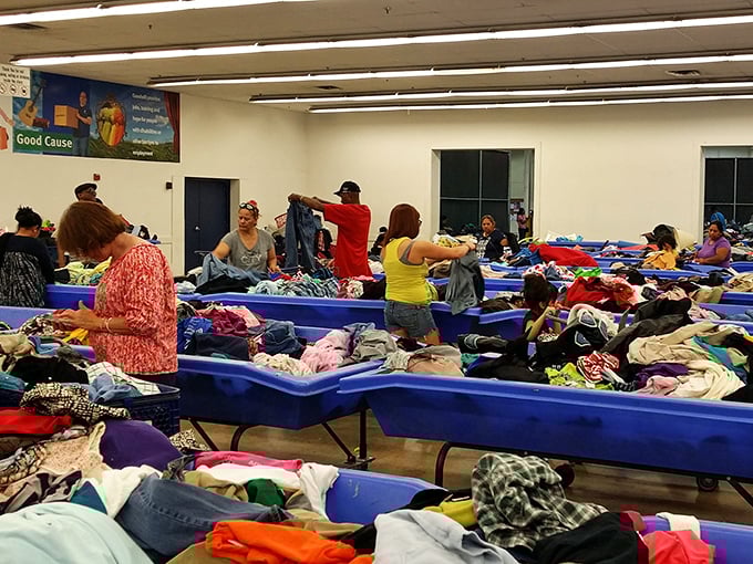 Organized chaos at its finest. Shoppers dive into the famous blue bins with the focus of paleontologists, each hoping to unearth that perfect vintage find.