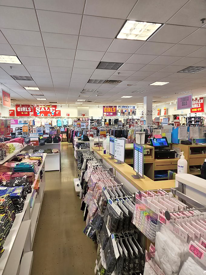 Sale signs light up like beacons of hope in this children's clothing store, where parents can outfit growing kids without emptying college funds.