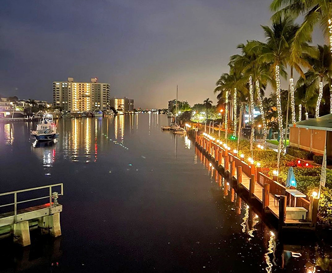 As night falls, the Intracoastal transforms into a mirror of lights, reflecting Delray's vibrant spirit in a watercolor painting that changes by the minute.