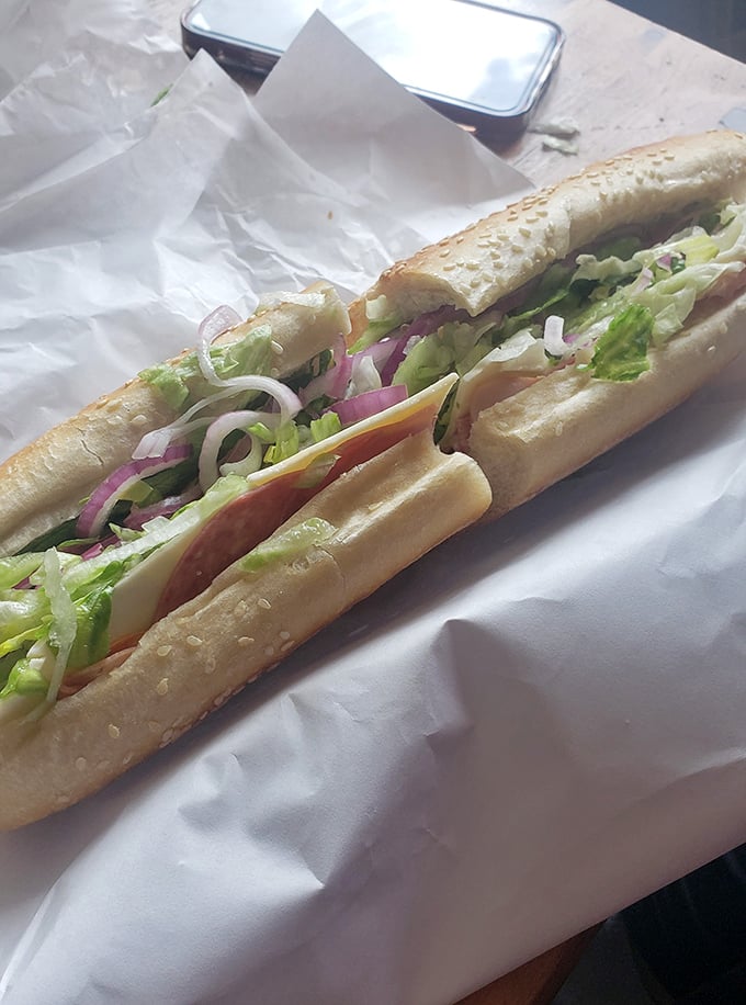 Behold the Italian hoagie in its natural habitat – perfectly layered meats, cheese, and veggies on a seeded roll. This isn't lunch; it's edible architecture.
