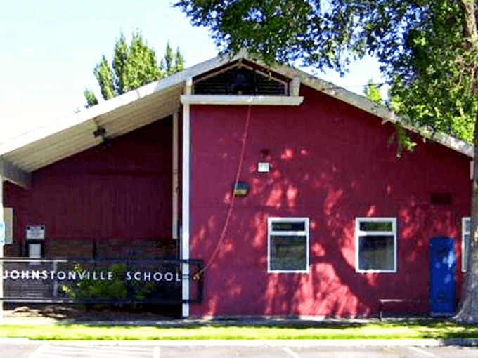 The Johnstonville School's distinctive red exterior houses something increasingly rare: classrooms where teachers know every student's name, learning style, and grandmother's cookie recipe.