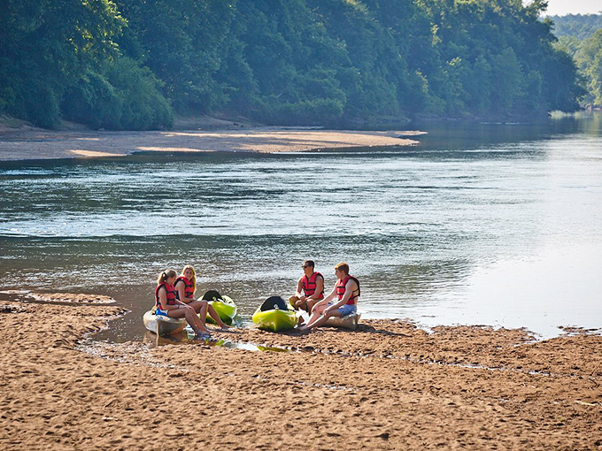 Nothing says "Georgia summer" quite like friends gathered at the river's edge, plotting their kayaking adventure while the water whispers, "Come on in."
