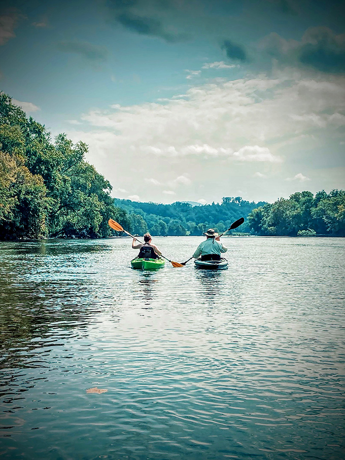 Two paddlers finding their rhythm on the James River's gentle current. Some therapy sessions don't require talking&mdash;just water and a paddle.