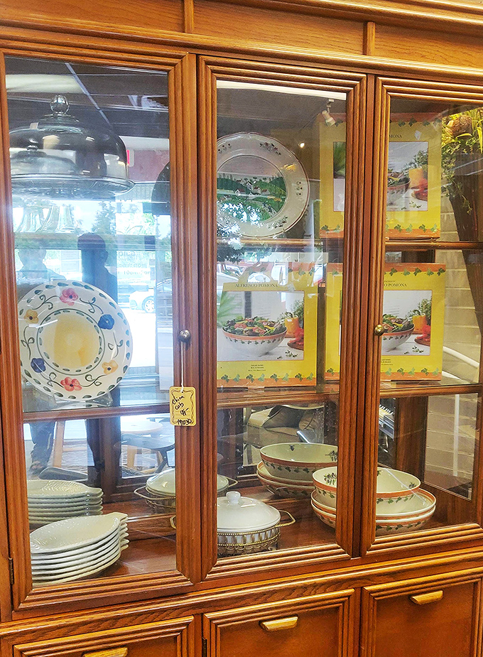 Fine china and decorative dishware displayed in wooden cabinets await their second chance to grace dinner tables and china hutches across Marion County.