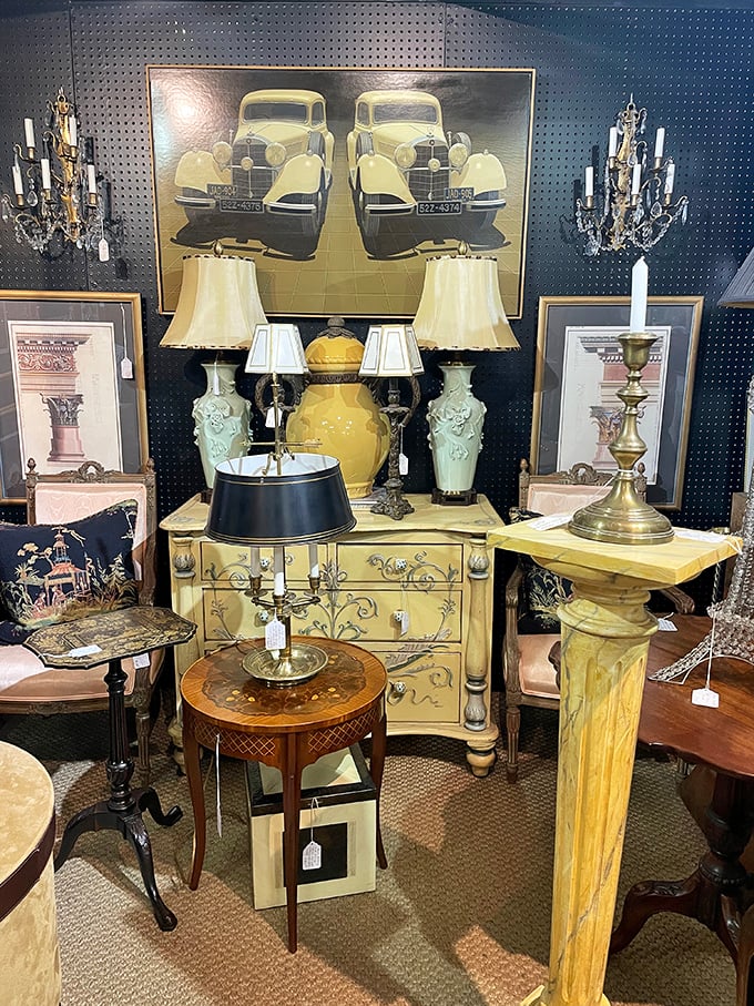 This display isn't just selling lamps&mdash;it's offering the chance to own a piece of automotive history with that stunning vintage car artwork. 