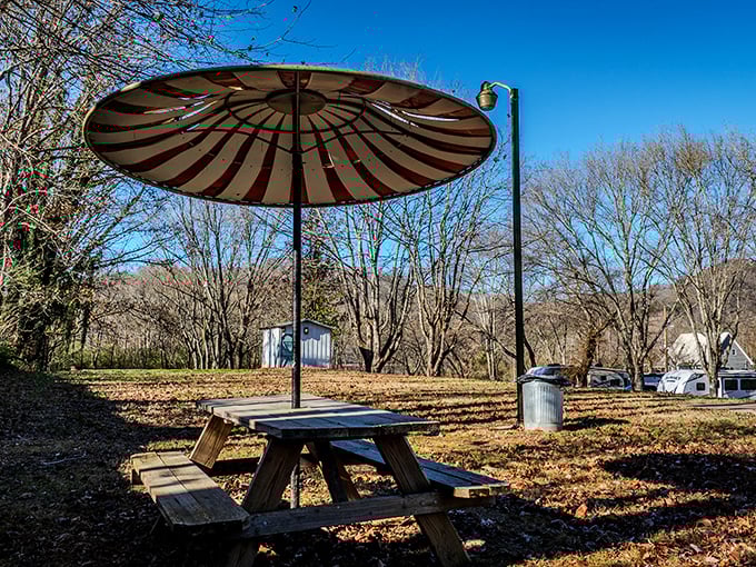 This striped umbrella picnic spot isn't trying too hard &ndash; it's just waiting for you to slow down, sit a spell, and remember what matters.