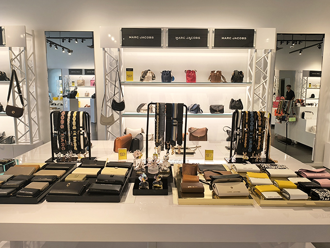 At the Marc Jacobs outlet, wallets and handbags are displayed with museum-like precision. Your credit card is about to become a patron of the arts.