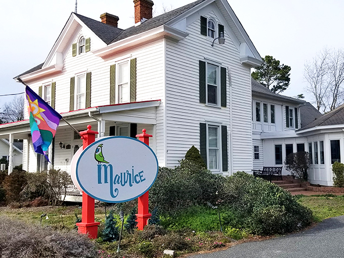 Maurice's charming white facade and colorful sign offer a warm welcome, like finding an unexpected letter from an old friend in your mailbox.