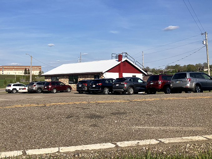 This unassuming red-roofed building has probably witnessed more hungry travelers than a highway rest stop. The packed parking lot tells you everything you need to know.