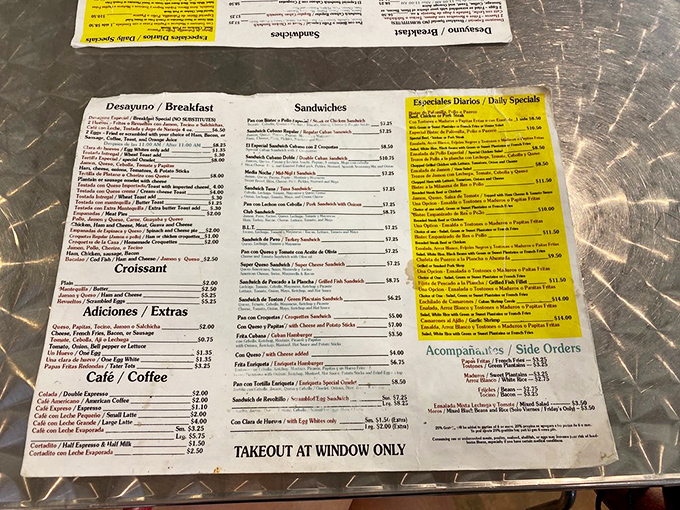 A menu that reads like a love letter to Cuban cuisine. Each laminated page holds the promise of flavor combinations that could make a food critic weep with joy.