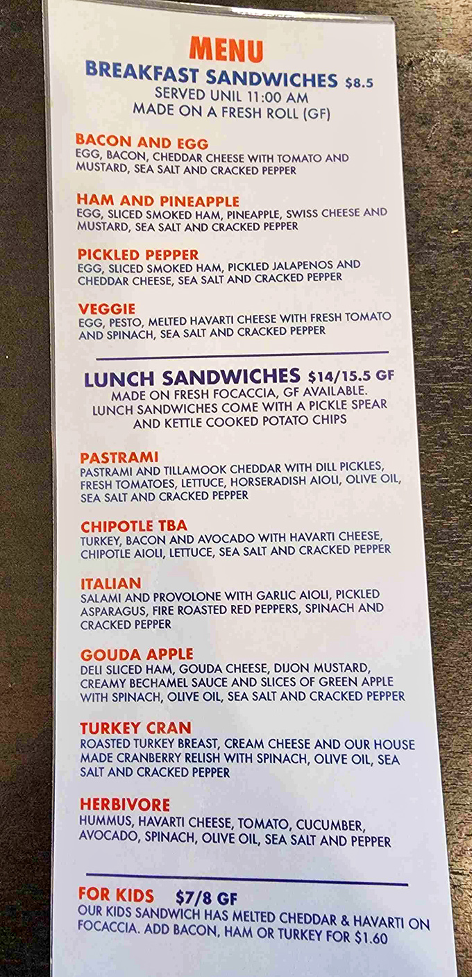 This menu isn't just a list of options—it's a roadmap to sandwich nirvana. The Ham and Pineapple breakfast sandwich alone is worth setting your alarm for.