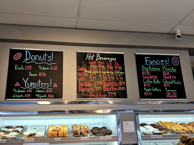 The chalkboard menu at Yum Yum speaks a universal language: "Donuts!" "Yumsters!" "Fancies!" &ndash; poetry that needs no translation.