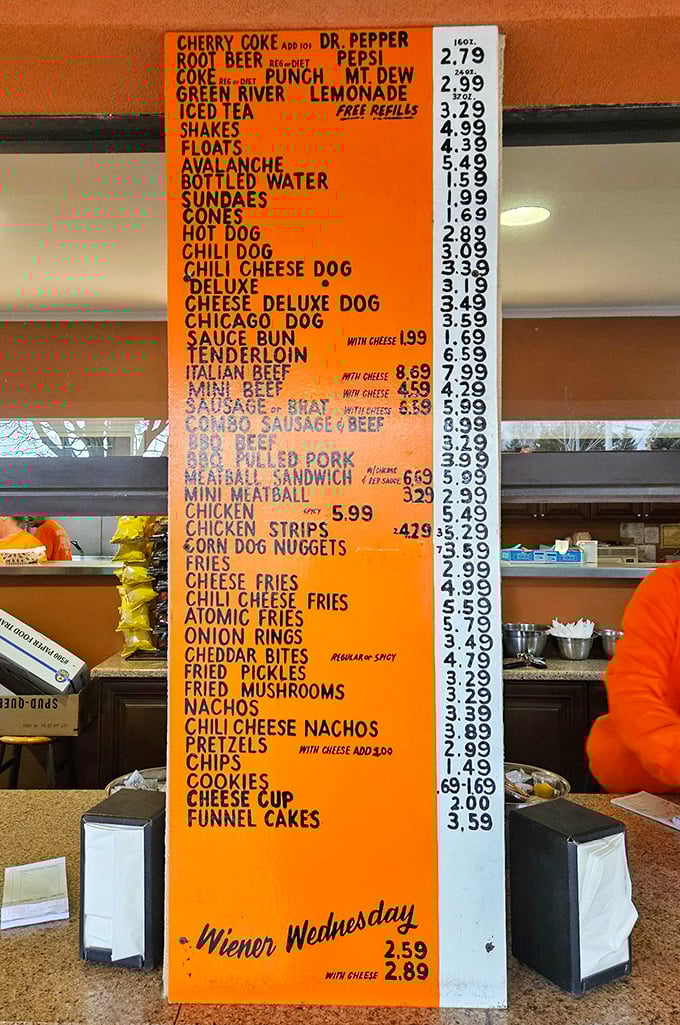 The bright orange menu board &ndash; a masterpiece of Midwestern minimalism where every item promises satisfaction without a hint of pretension.
