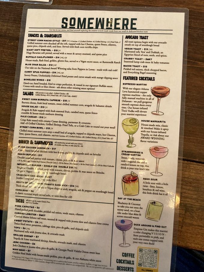 Somewhere's menu reads like a culinary adventure map, from Street Corn Nachos with hot Cheetos to craft cocktails that transport you to island time.