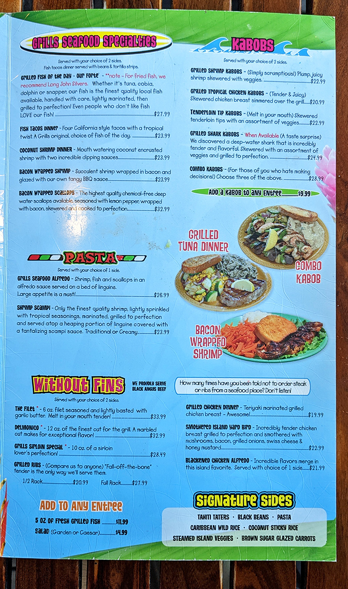 A menu that reads like a love letter to the ocean. The "How many times have you been told not to order steak at a seafood place?" quip is pure Florida sass.