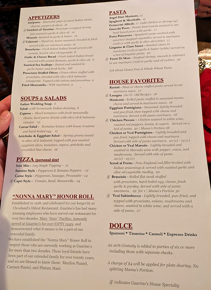 The menu reads like a love letter to Italian-American cuisine, with house specialties marked by quill symbols and a touching "Nonna Mary" honor roll.