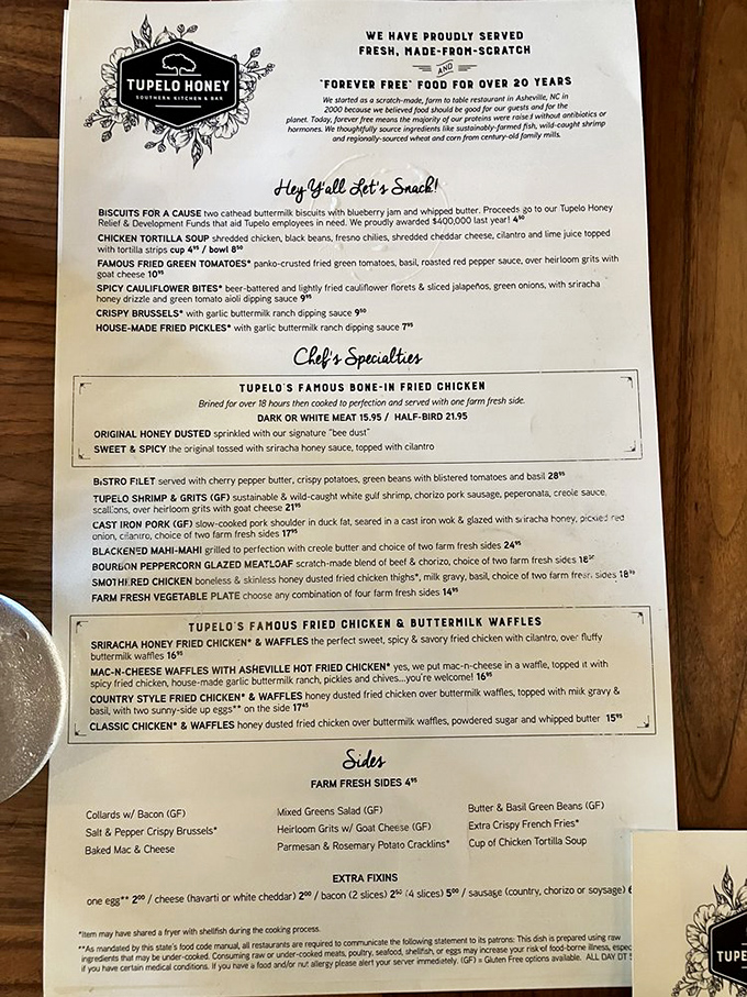 The menu reads like a Southern grandmother's secret diary – complete with bone-in fried chicken and "Hey Y'all Let's Snack!"