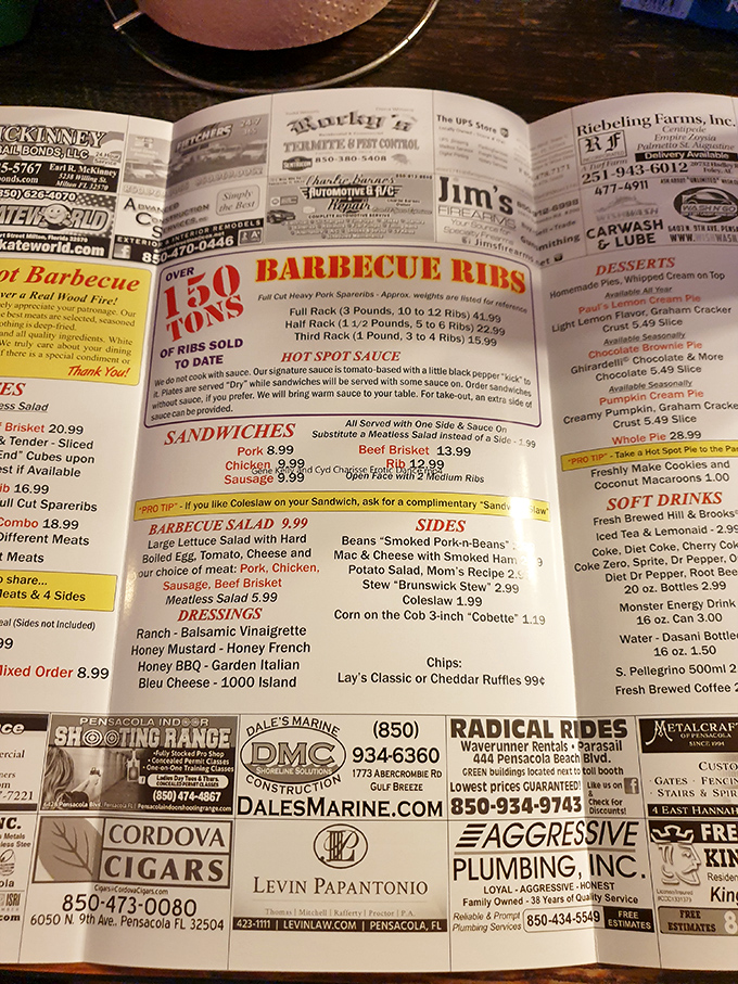 The menu reads like a love letter to smoked meat enthusiasts, with over 50 tons of ribs sold proudly announced at the top.