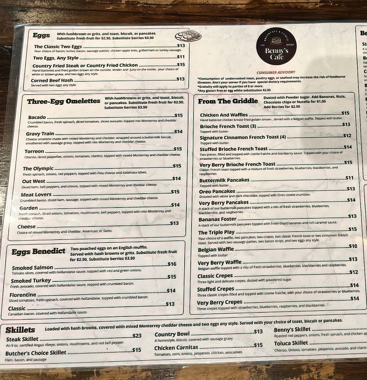 The menu at Benny's reads like breakfast poetry – from the intriguingly named "Gravy Train" to the "Very Berry" everything that promises fruity redemption.