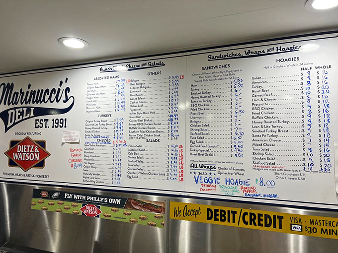 The menu board—a sacred text of sandwich possibilities—hangs behind the counter, promising Italian hoagie nirvana to those who seek it.