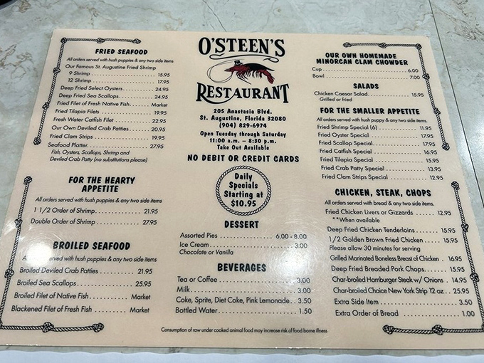 A menu that hasn't surrendered to QR code tyranny &ndash; just honest seafood offerings printed on actual paper like civilization intended.