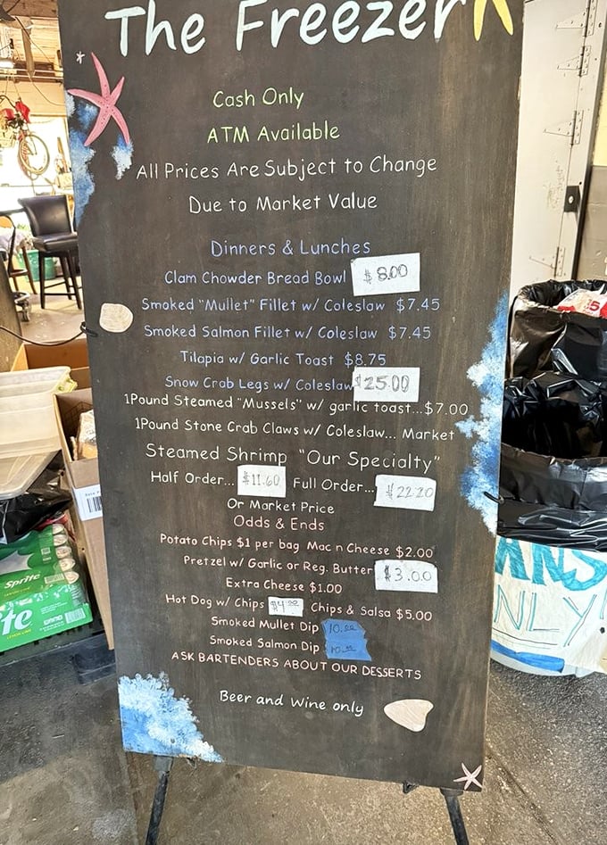 The chalkboard menu tells you everything you need to know: fresh seafood, cold beer, and prices that fluctuate with the tides.