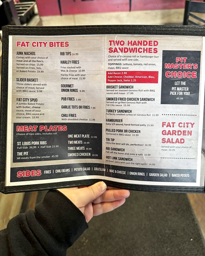 A menu that reads like poetry to carnivores. Each line promises smoky delights that'll have you plotting your next visit before finishing the first.