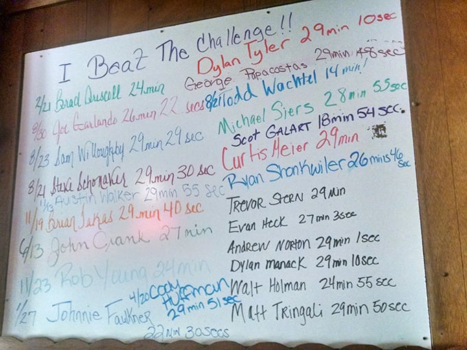 "I Beat The Challenge!" proclaims the wall of fame, where brave souls have faced their appetites and emerged victorious, their glory immortalized in marker.