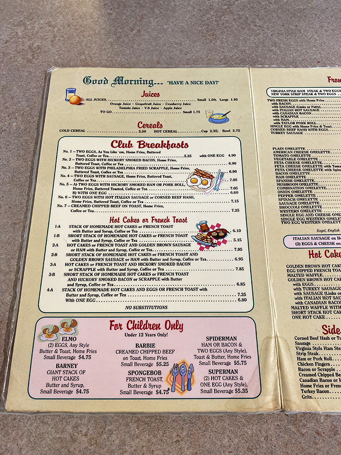 A menu that reads like comfort food poetry. The children's section with Elmo and Spiderman options proves breakfast joy spans generations.