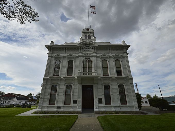 The Mono County Courthouse stands like a Victorian time capsule, its white facade and ornate details whispering tales of frontier justice and gold rush drama.