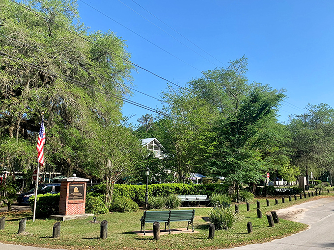 A peaceful corner of Monument Park offers a quiet respite, complete with benches perfect for people-watching or contemplating life's simpler pleasures.