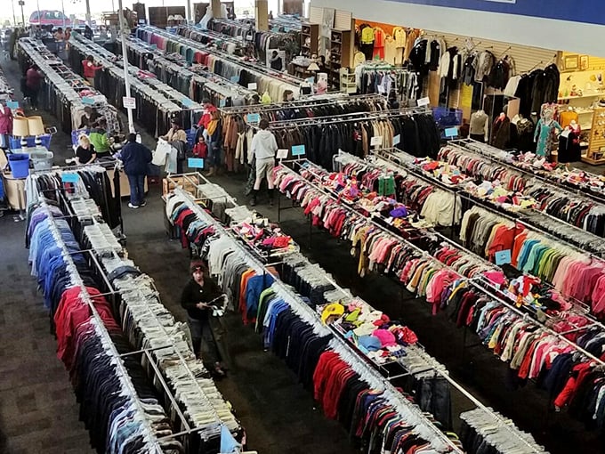 Rows upon rows of meticulously organized clothing create a rainbow roadmap to fashion finds. It's like the Library of Congress, but for cardigans.