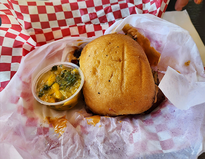 Not just a sandwich, but an edible work of art. The golden bun cradles smoky goodness while that cup of mango salsa waits to elevate each bite.