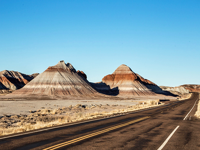 The ultimate road trip reward. These banded buttes look like they were designed by a geological pastry chef who specializes in layer cakes. 