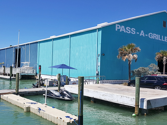 The turquoise marina building isn't just eye-catching&mdash;it's a portal to aquatic adventures waiting just beyond those wooden docks.