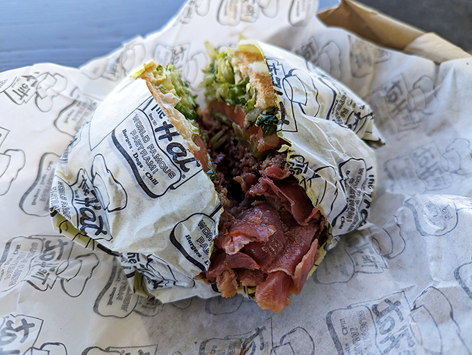 The pastrami sandwich in all its glory&mdash;a mountain of thinly-sliced, perfectly seasoned meat that makes other sandwiches look like they're not even trying.