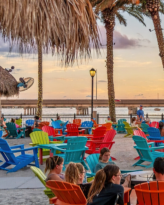 Rainbow-colored Adirondack chairs at sunset &ndash; where Florida's happy hour means nature puts on a show while you sip something cool and contemplate absolutely nothing.