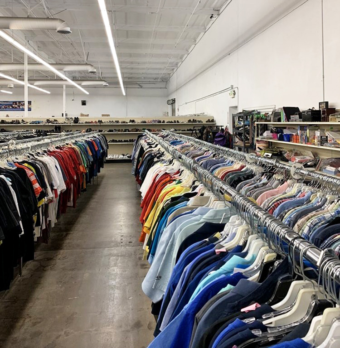 Color-coded clothing heaven stretches to the horizon. Marie Kondo would weep with organizational joy at this thrifter's paradise.