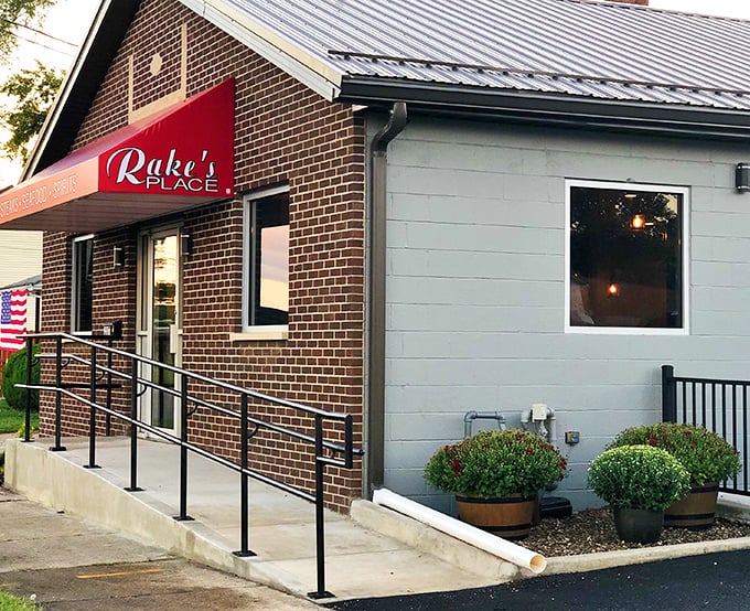 Rake's Place combines brick-and-mortar charm with hometown hospitality, offering a welcoming entrance that practically says, "Come on in, the comfort food's fine!"