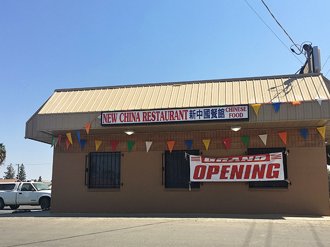 New China Restaurant stands ready to serve, its colorful bunting a cheerful welcome sign to hungry visitors seeking no-frills Chinese-American classics.