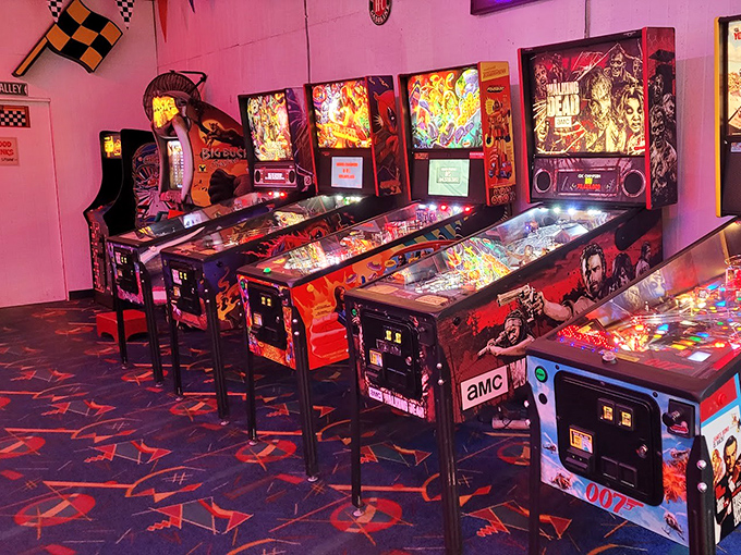 The neon glow of pinball paradise &ndash; where quarters disappear faster than your resolution to "just play one game."