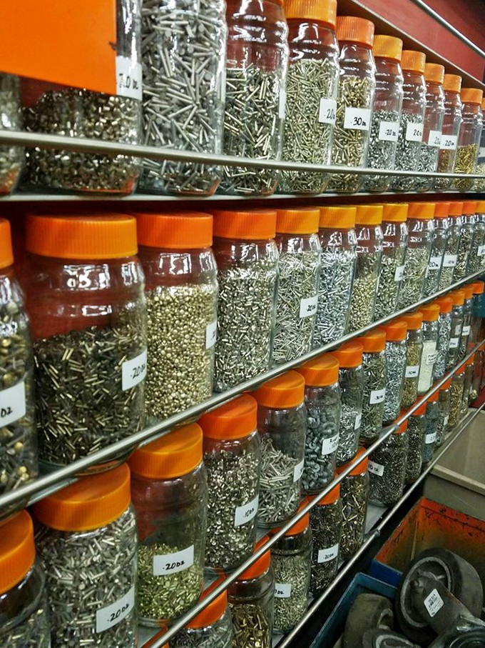 Tiny metal marvels organized with military precision. Each jar contains not just hardware, but potential adventures waiting to be unleashed. 