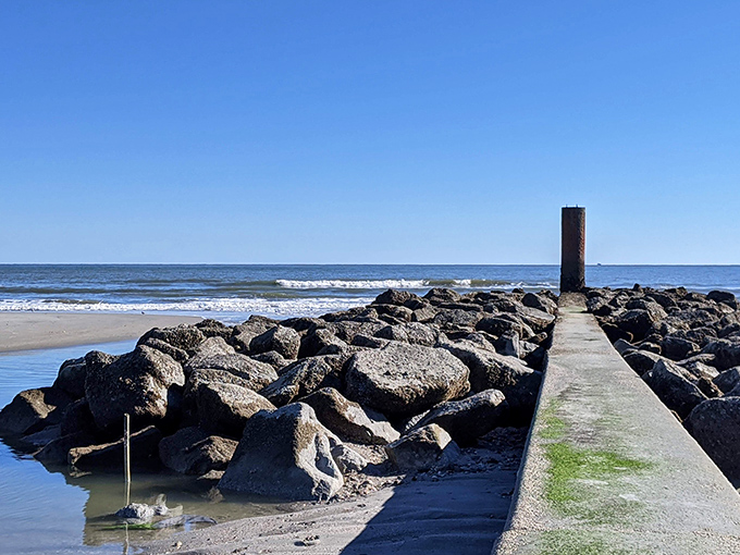 The jetty: part rock sculpture, part engineering marvel. This stone pathway into the Atlantic serves as both coastal protection and impromptu fishing platform.